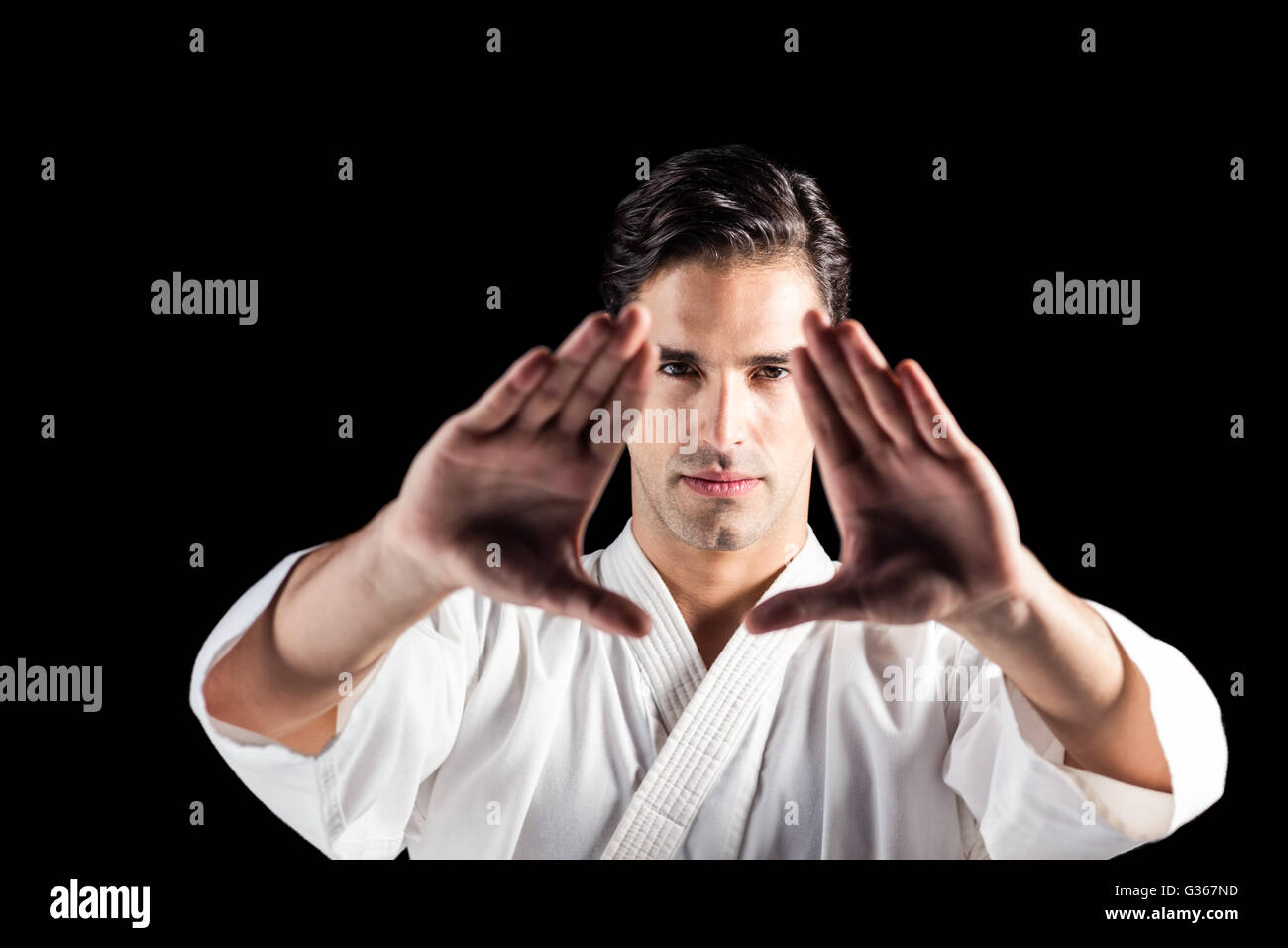 Portrait of fighter performing karate stance Stock Photo - Alamy