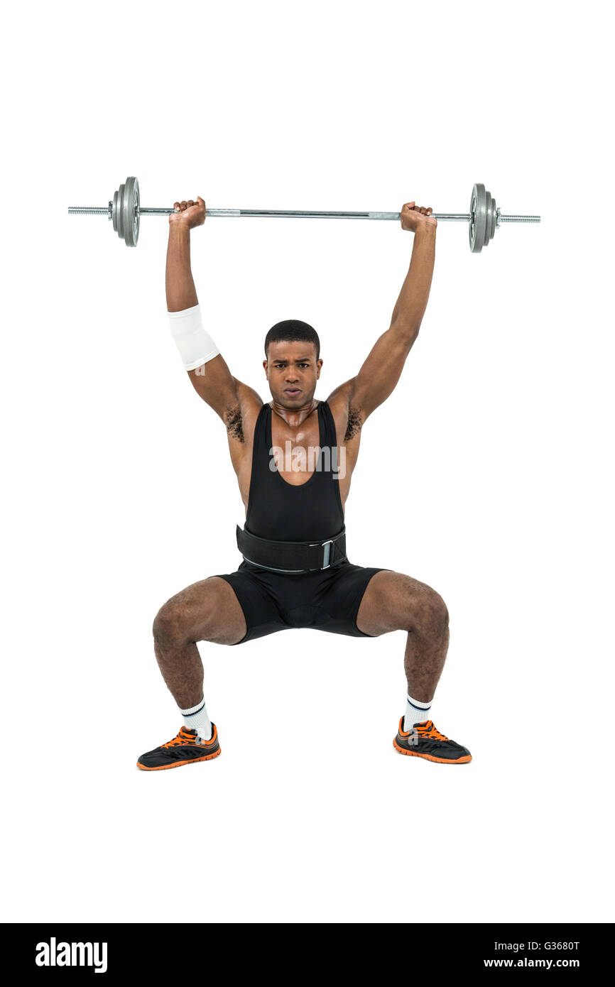 Bodybuilder lifting heavy barbell weights Stock Photo - Alamy