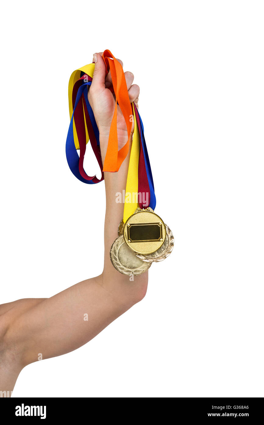 Athlete holding gold medals after victory Stock Photo - Alamy