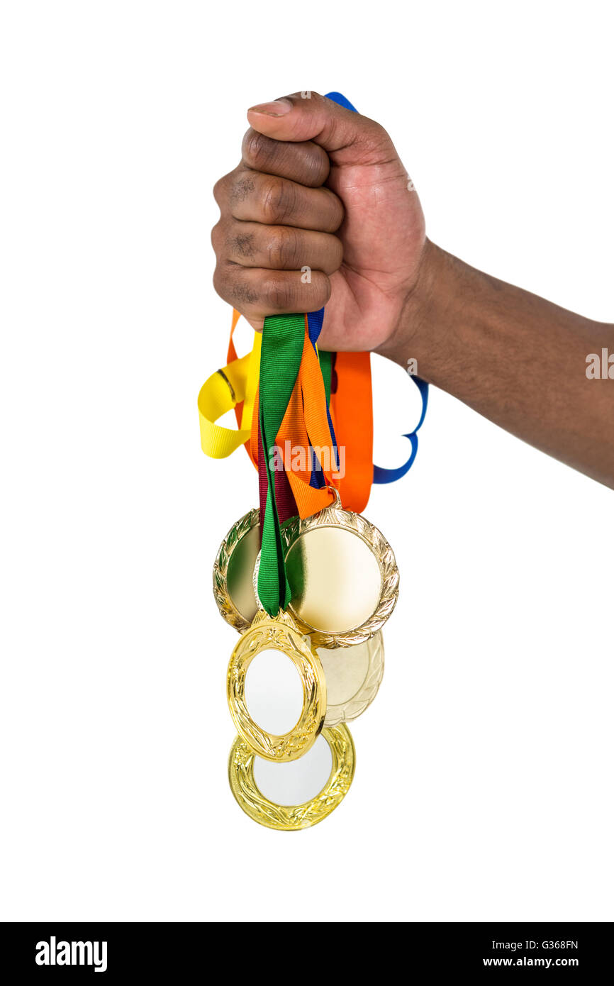 Athlete holding gold medals after victory Stock Photo - Alamy