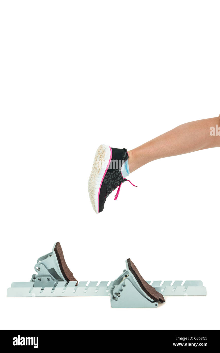 Female athlete in position ready to run Stock Photo - Alamy