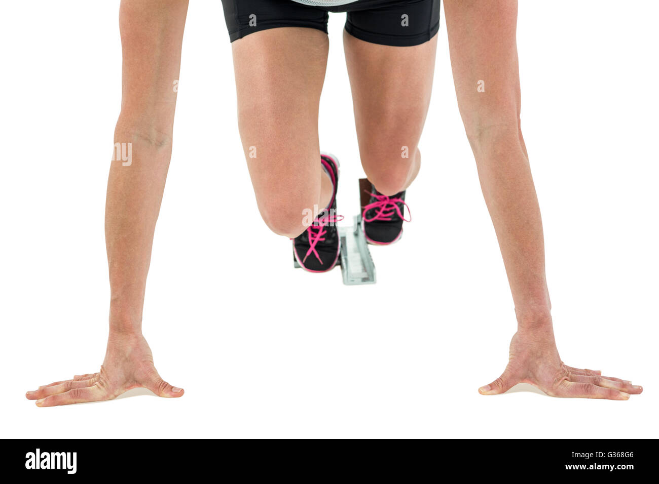 Female athlete in position ready to run Stock Photo - Alamy