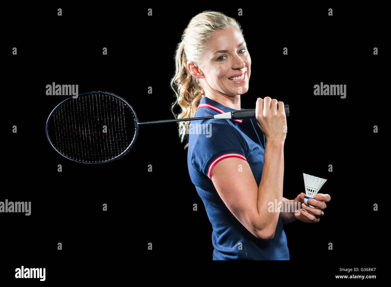 Badminton player holding racket and shuttlecock Stock Photo - Alamy