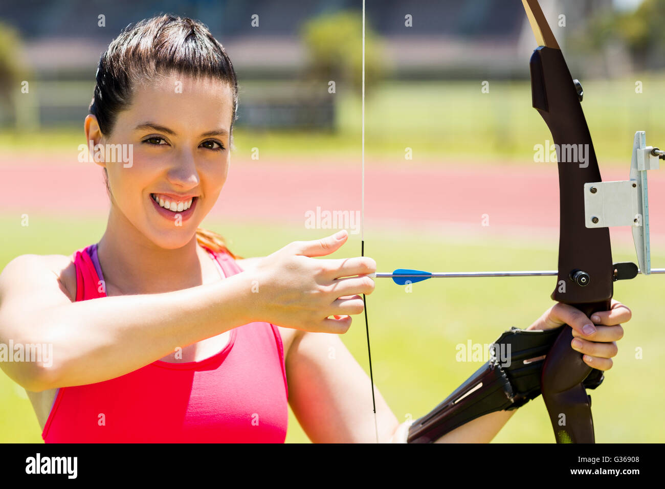 Female athlete practicing archery Stock Photo - Alamy