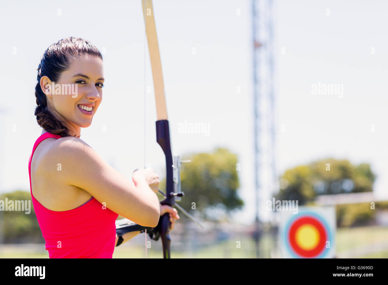Female athlete practicing archery Stock Photo - Alamy