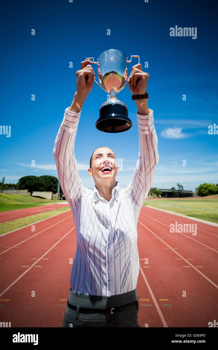 White Runner Holding Trophy