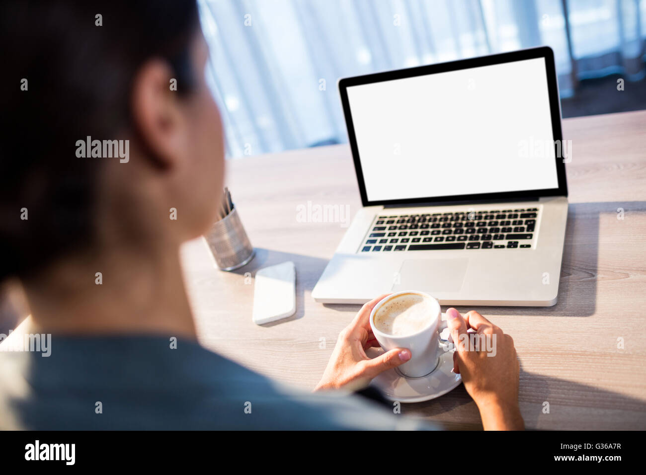 Businesswoman using wireless computer workplace hi-res stock ...