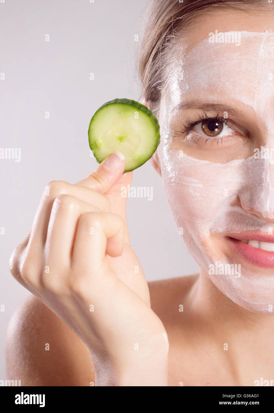 Beauty women getting facial mask Stock Photo - Alamy