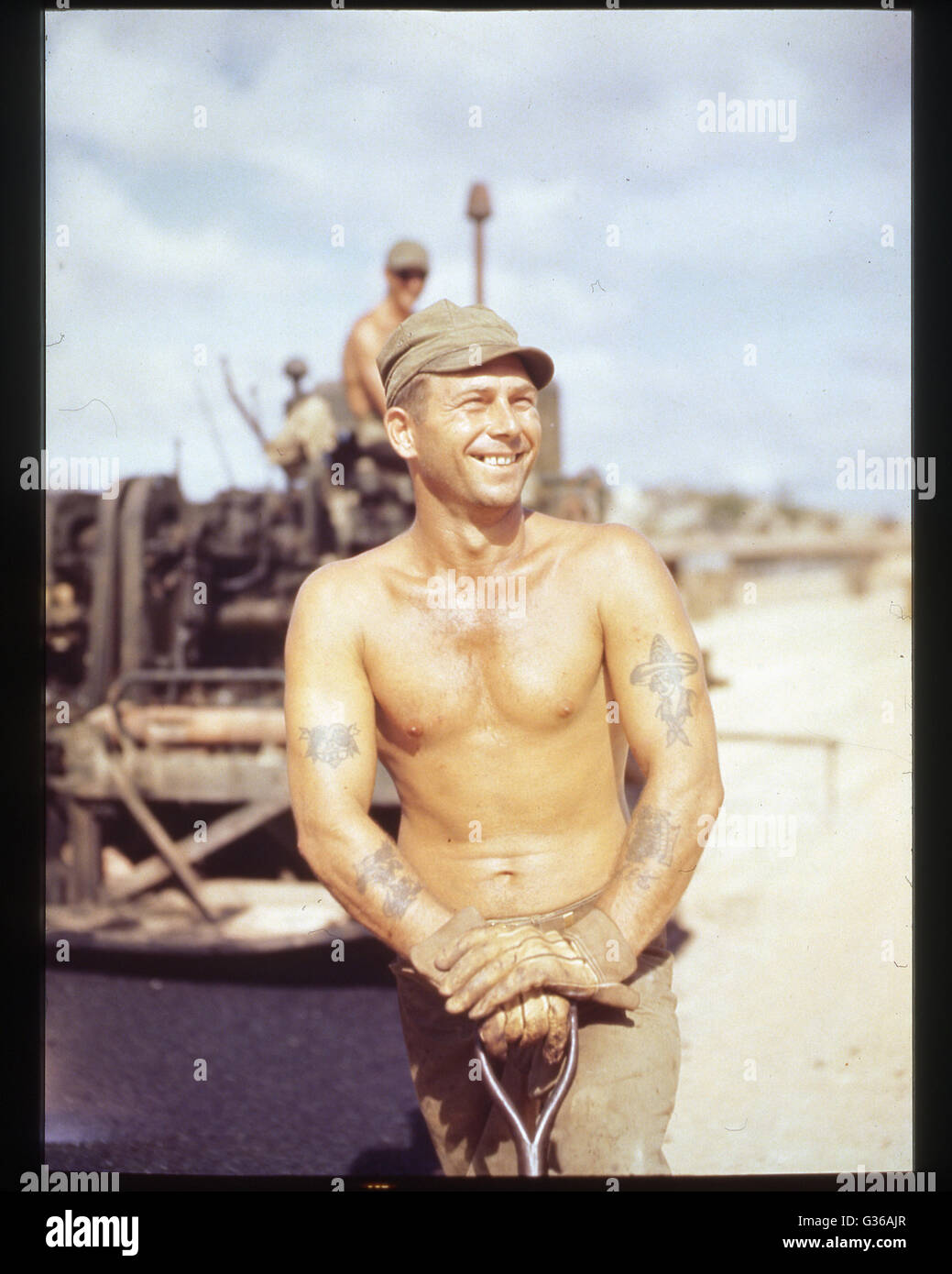 Shipfitter Second Class Steven J. Kusial working on Seabee Road crew on ...