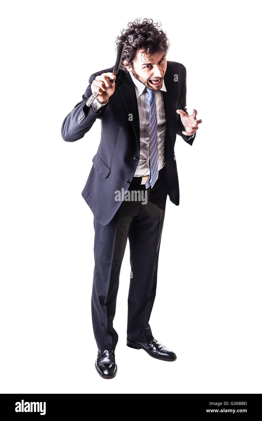 a young and handsome businessman holding a cut-throat razor isolated ...
