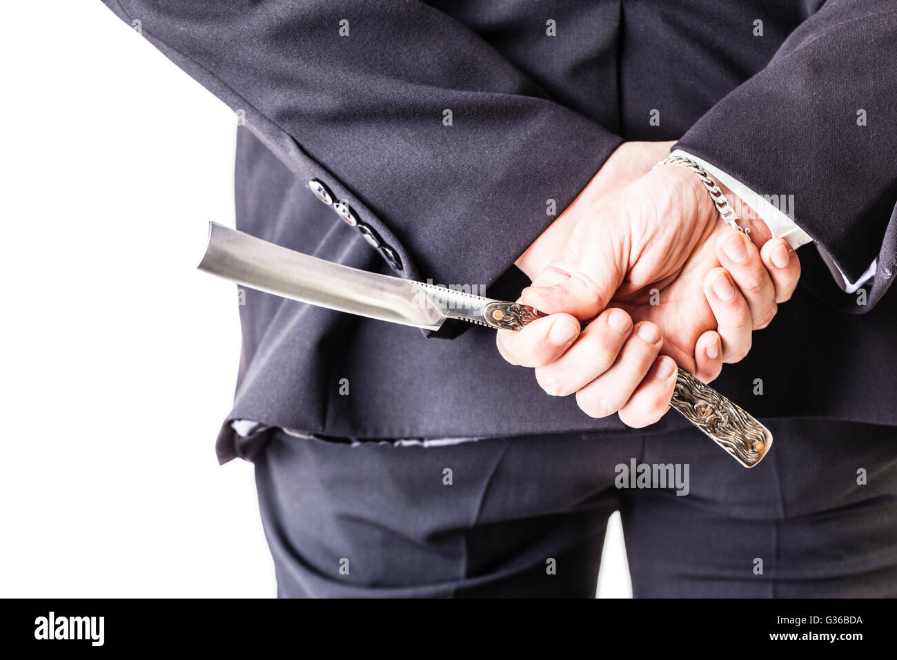 a young and handsome businessman holding a cut-throat razor isolated ...