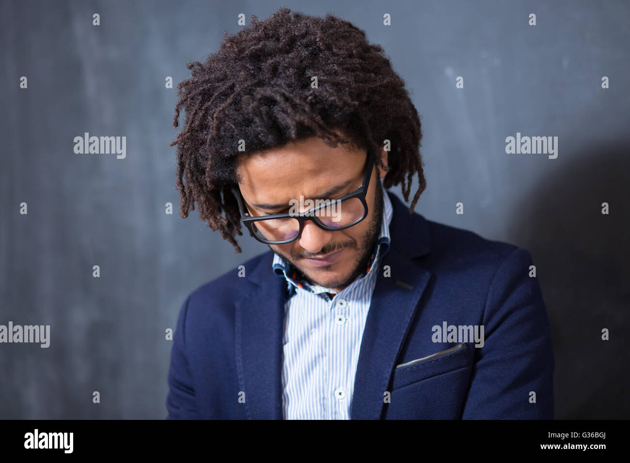 Casually handsome. Portrait of joyful young Arabic man standing against ...