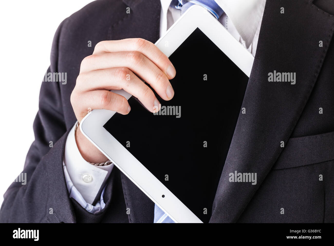 a young and handsome businessman holding a tablet isolated over a white ...
