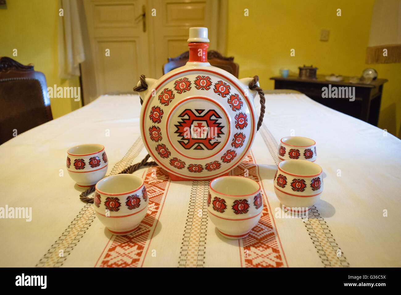 Traditional plum bottle and glasses Stock Photo - Alamy