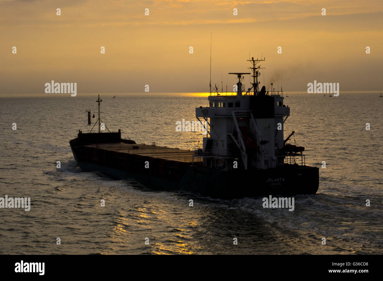 Jolanta gerneral cargo ship coaster sunset Belfast lough Stock Photo ...
