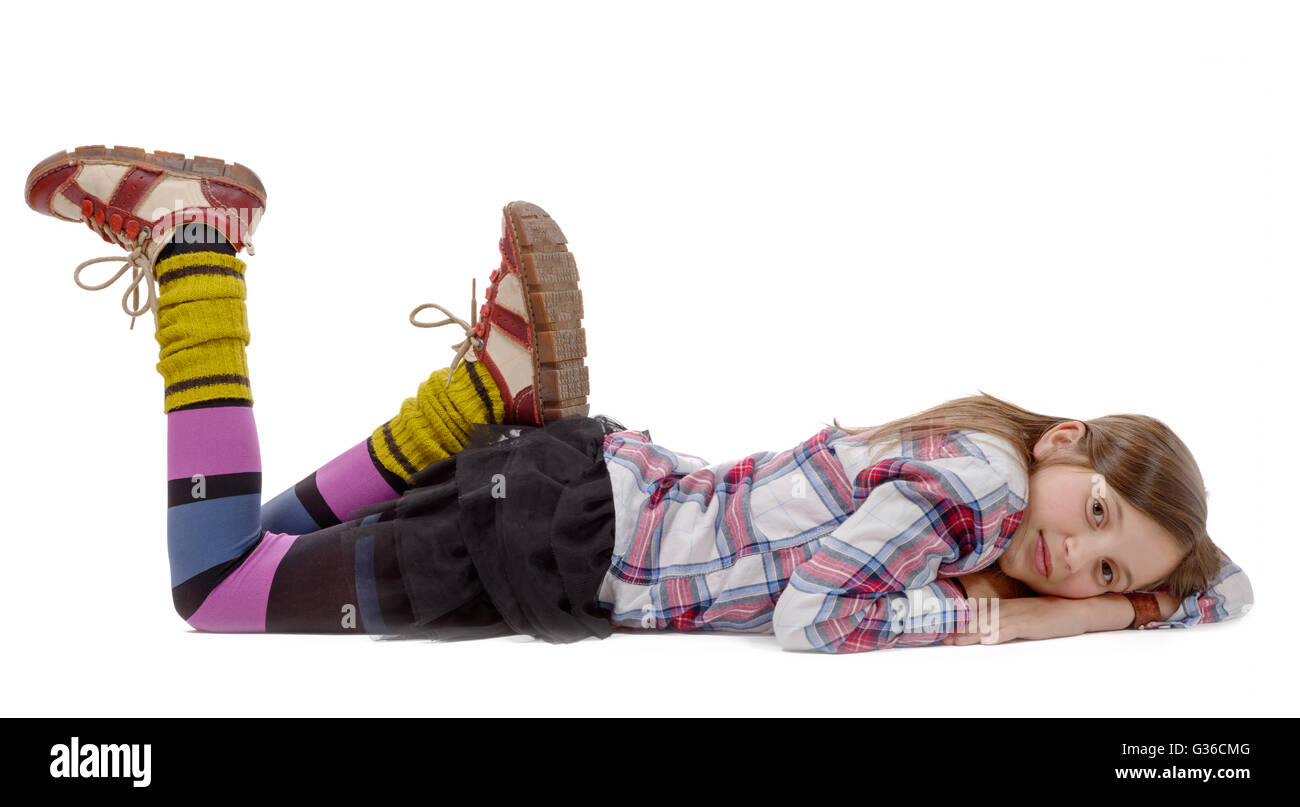 preteen girl in hipster style, lying on the floor, isolated on white ...