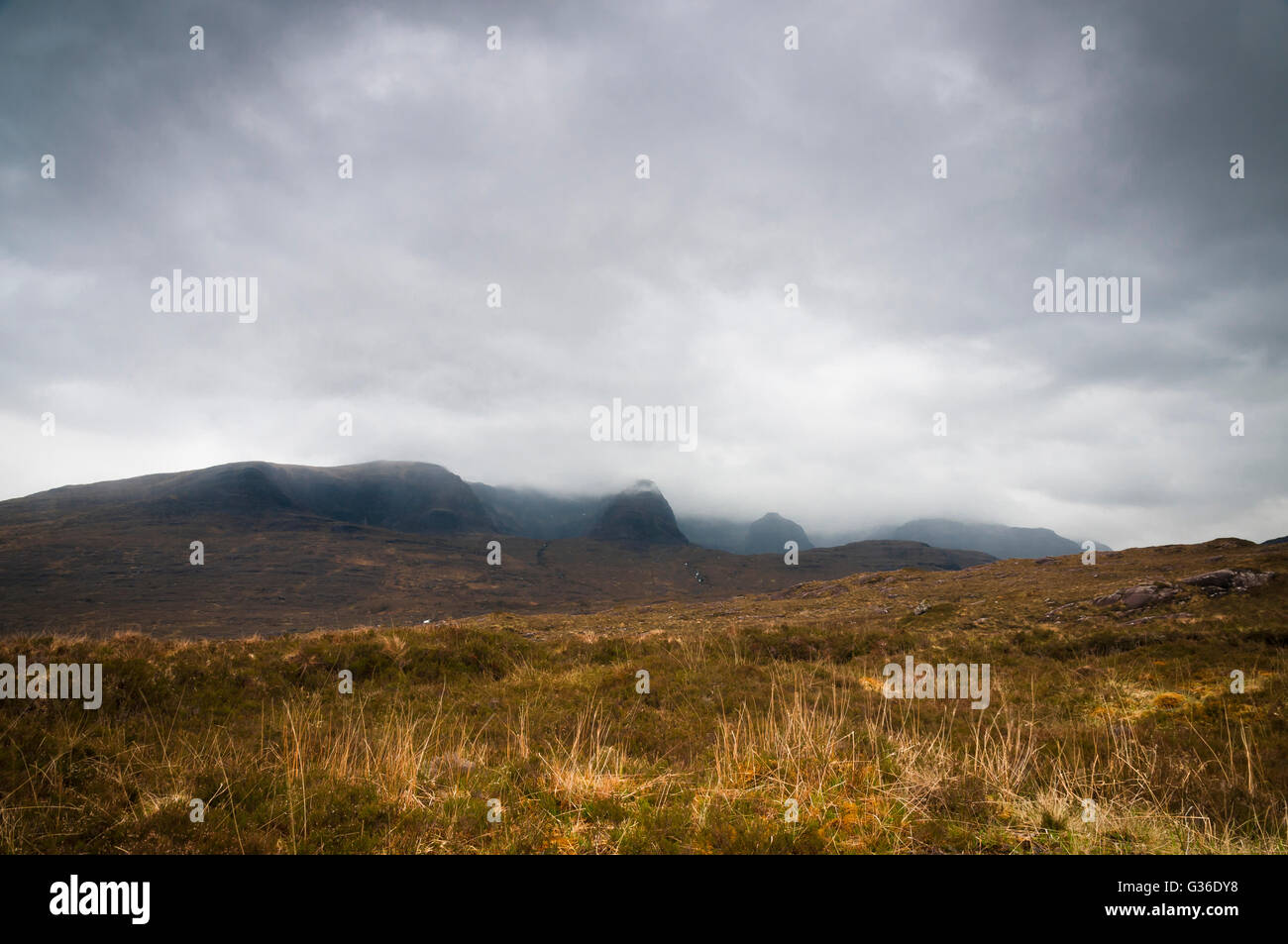 Mist and heavy cloud shrouding the tops of Beinn Bhan in Glen Kishorn ...