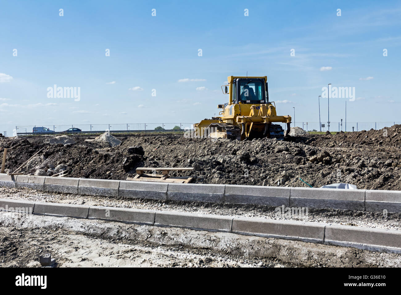 Construction site, the roadside stones are lined and placed on gravel ...