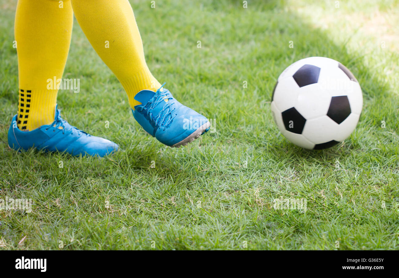 Man kicking a ball hi-res stock photography and images - Alamy