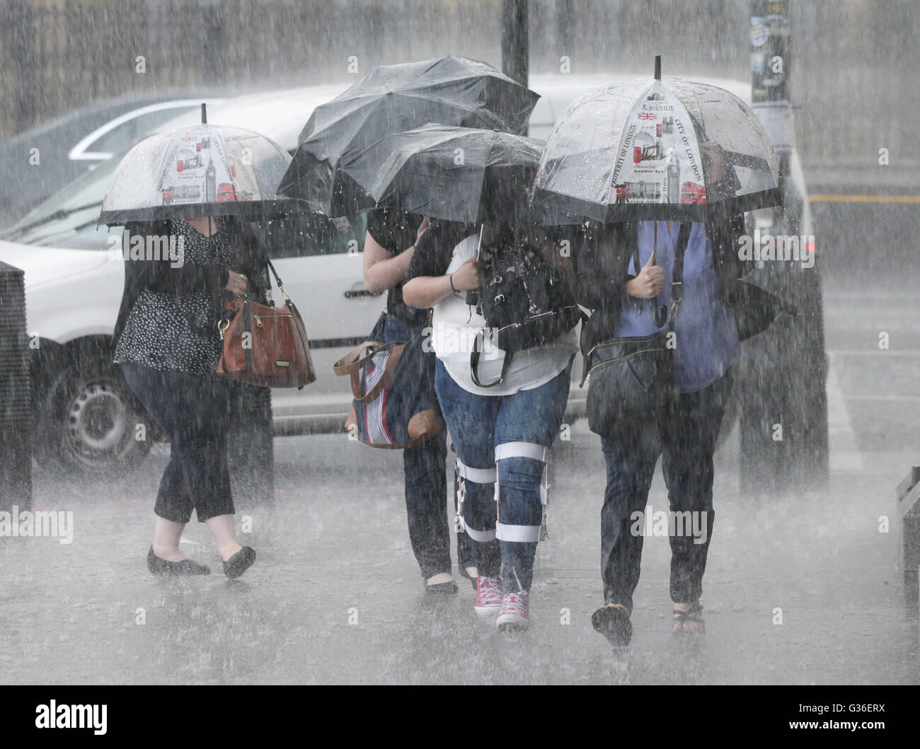 People are caught out in heavy rain in westminster hi-res stock ...
