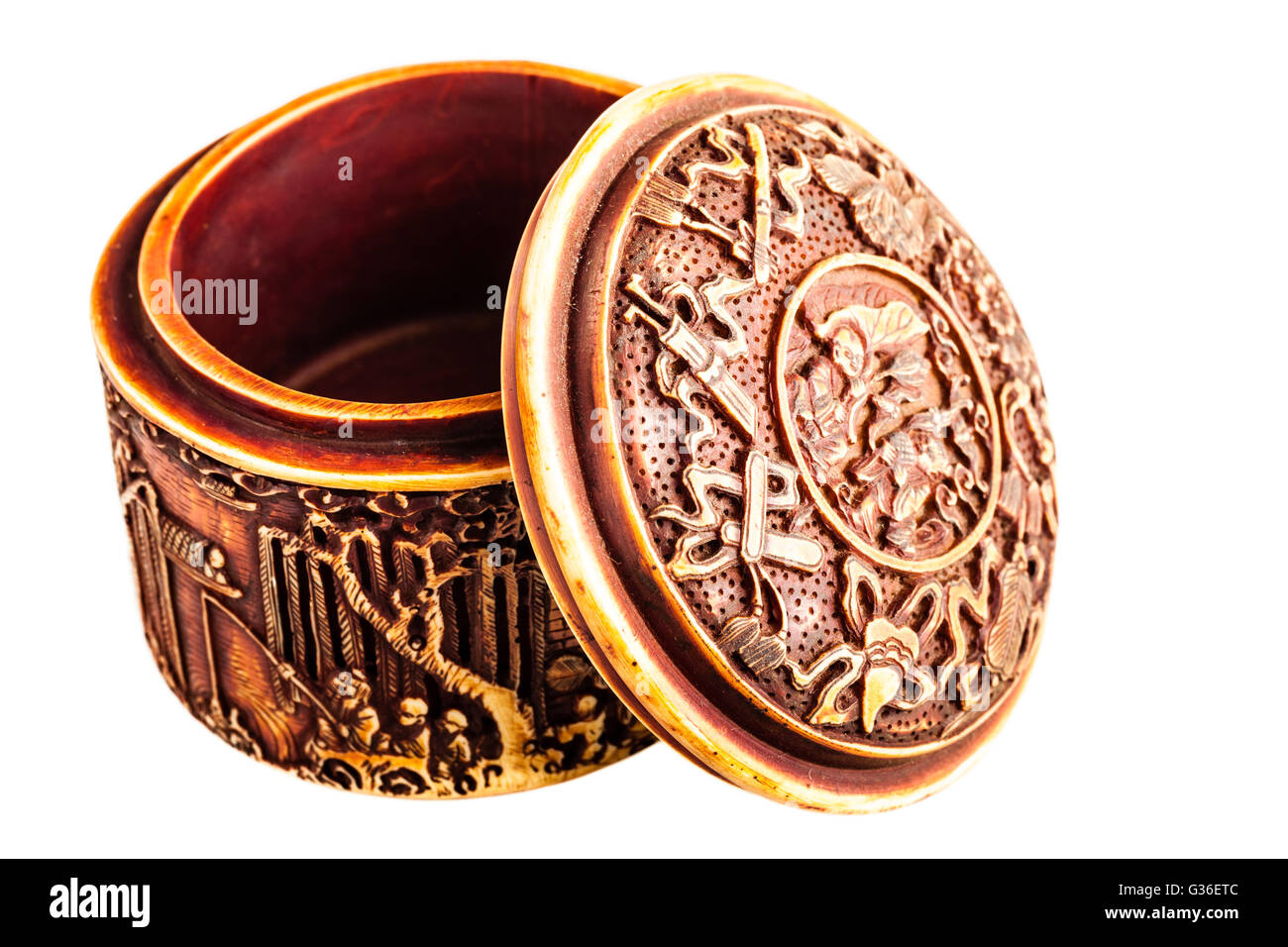 an ancient chinese ornated container isolated over a white background ...