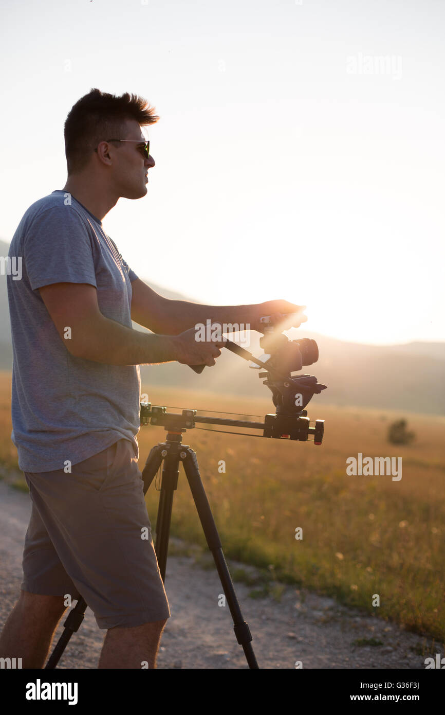 photographer taking photo in wild Stock Photo - Alamy