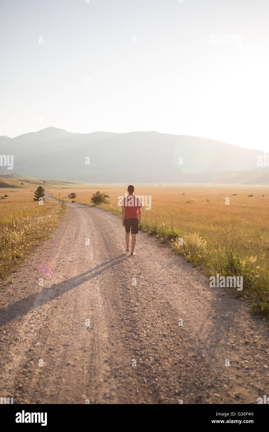 Homeless man walking away hi-res stock photography and images - Alamy