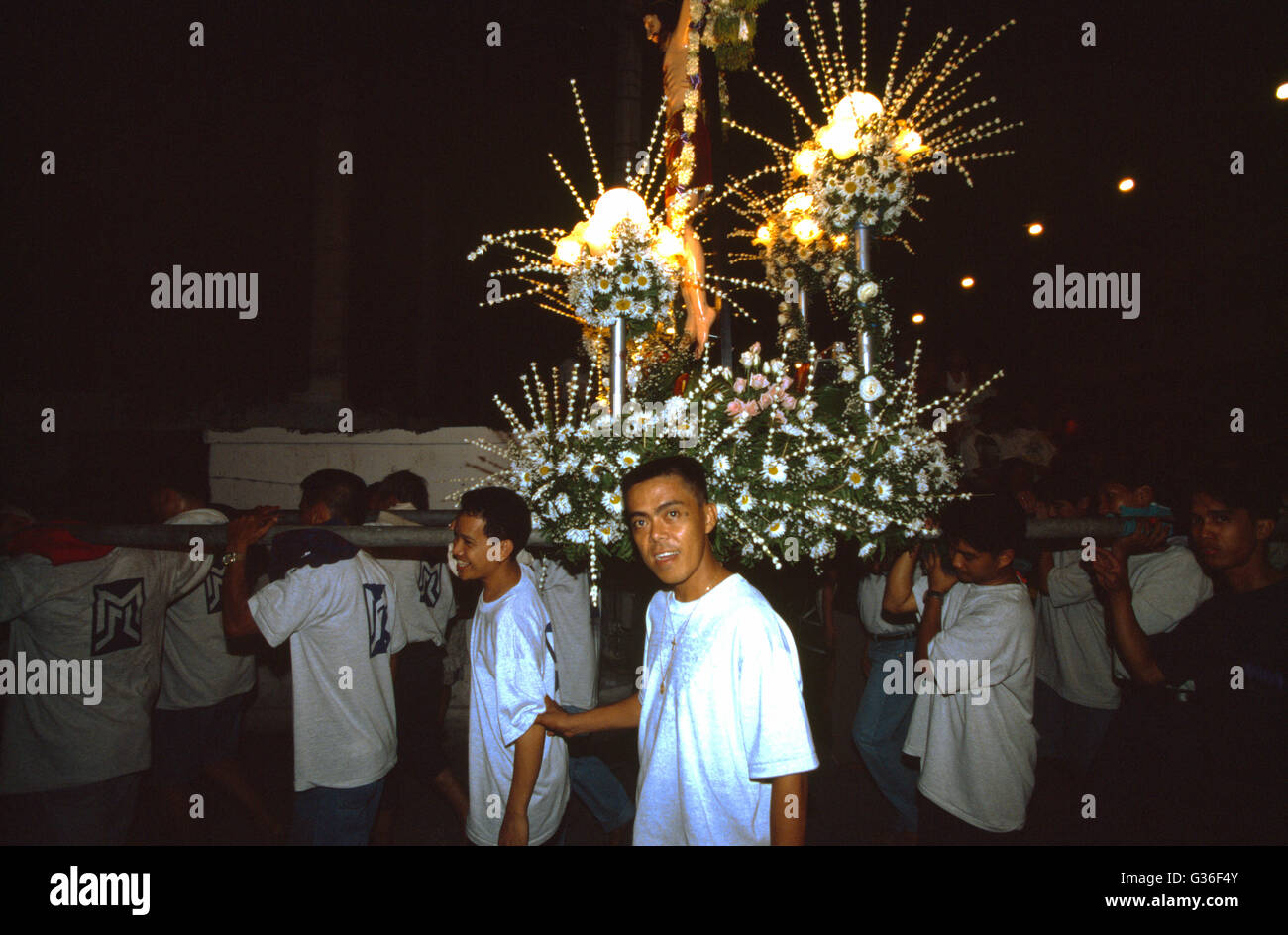 Men carrying religious float at Easter Mass At Luneta Park Open Air ...