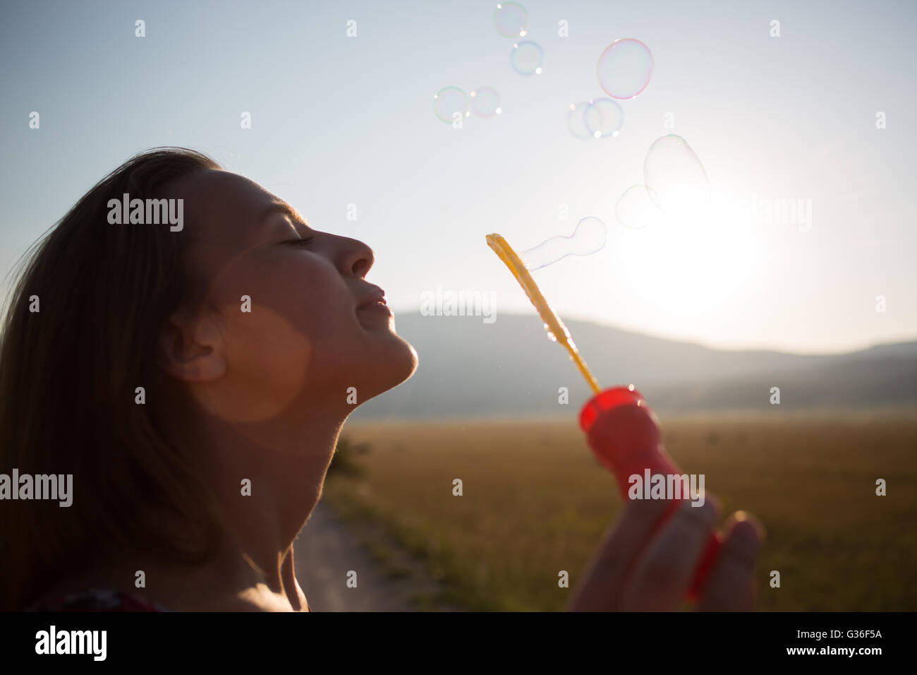 Bubble blower woman Stock Photo - Alamy