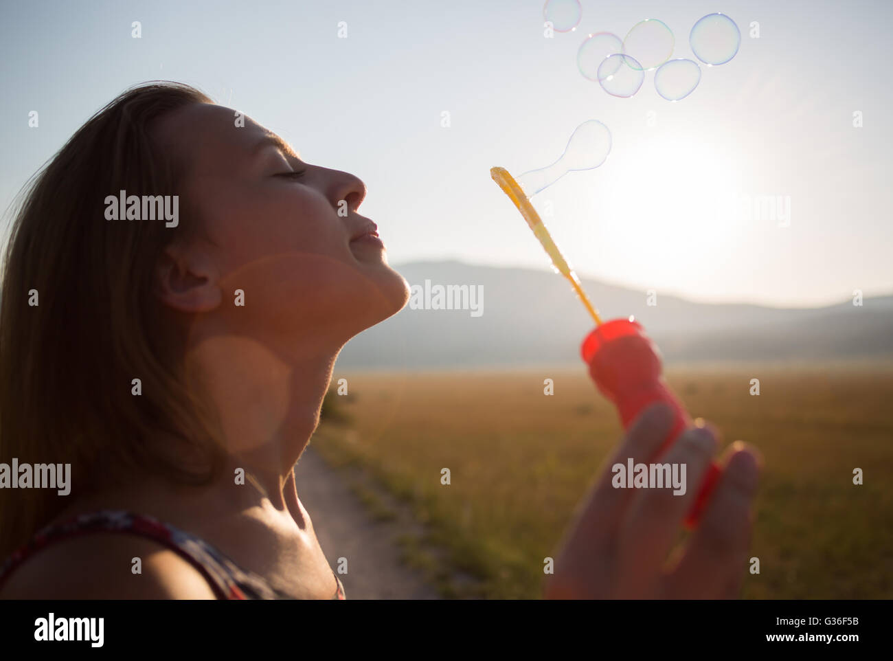 Bubble blower woman Stock Photo - Alamy