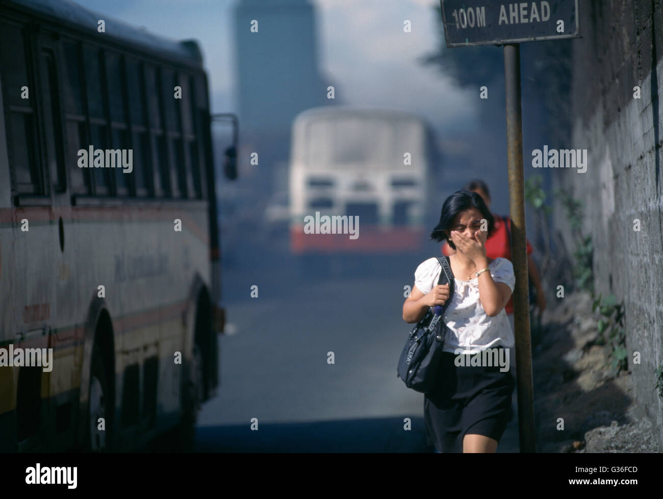 Bus Exhaust Fumes, Pedestrian With Hand Over Her Mouth & Nose, Manila ...