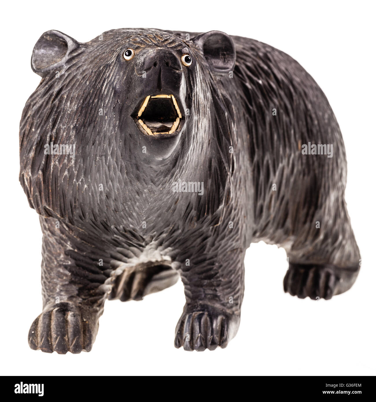 a big wooden bear figurine isolated over a white background Stock Photo ...