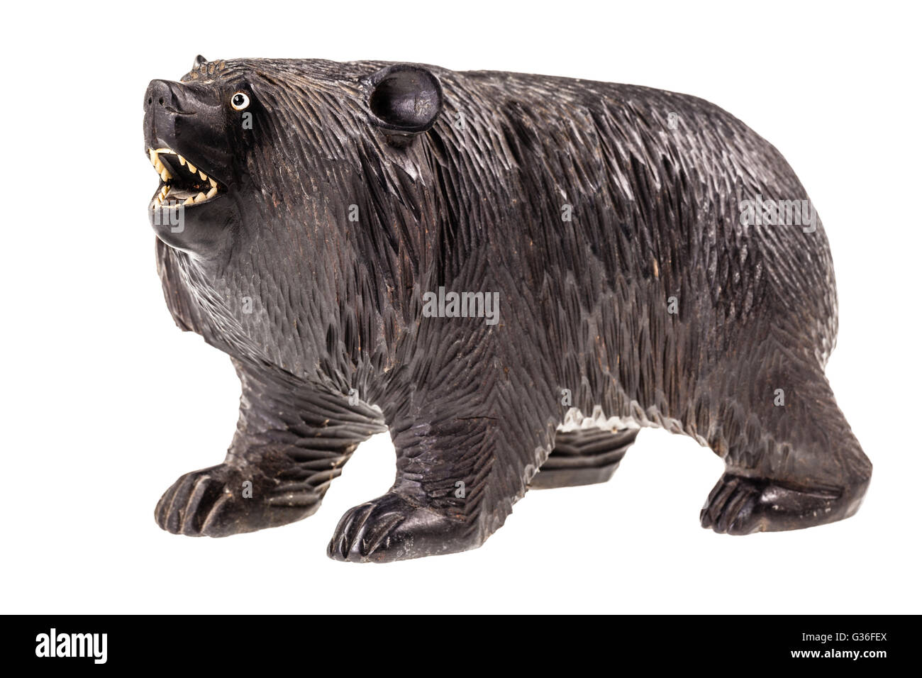a big wooden bear figurine isolated over a white background Stock Photo ...