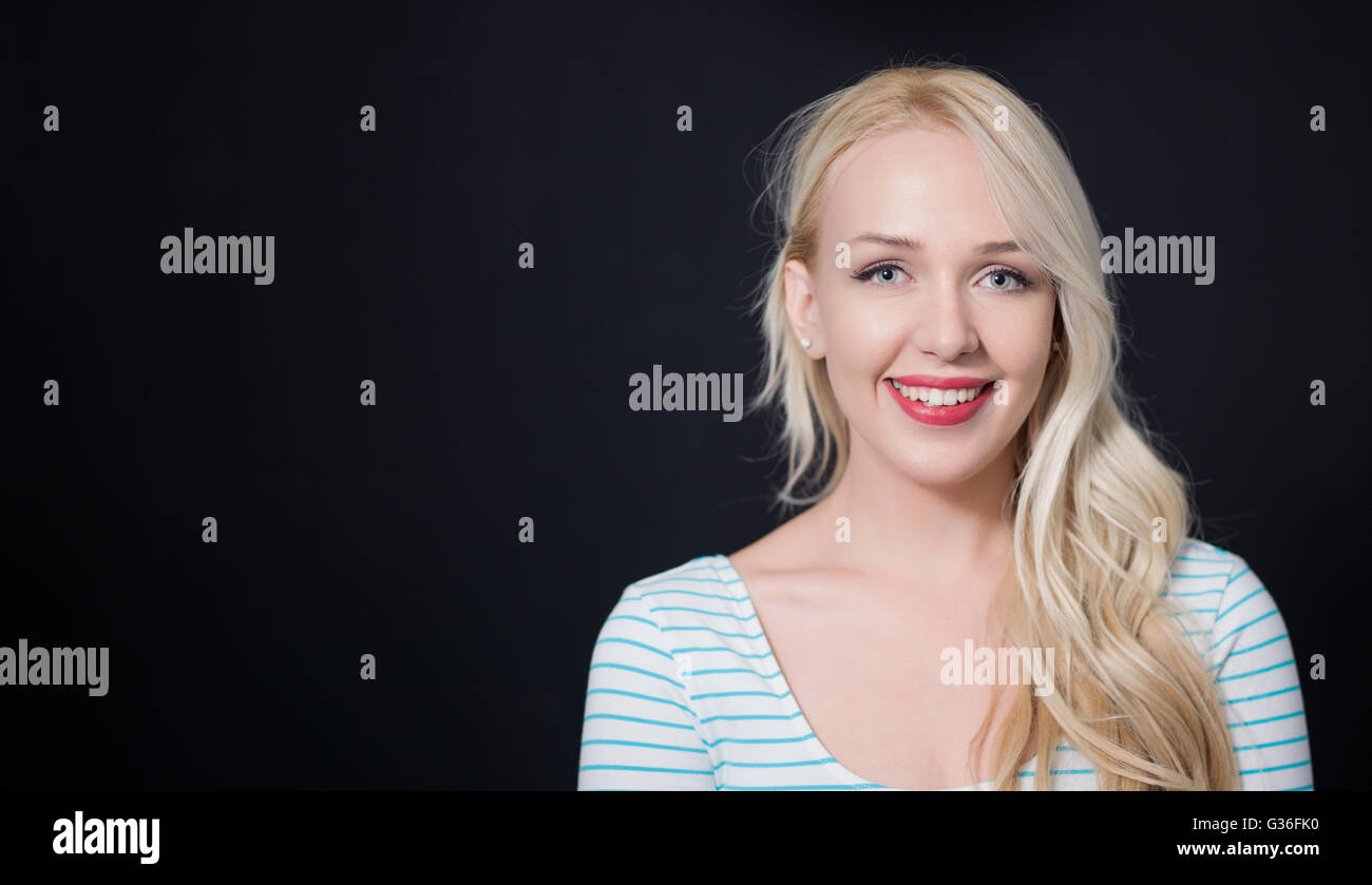 Beautiful young business manageress or female executive posing in front ...