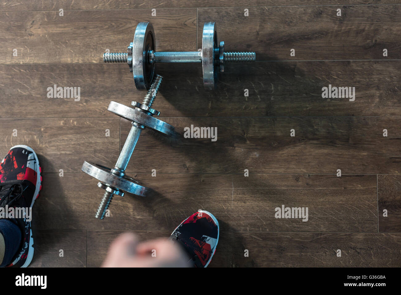 Top view of a dumbells on a wooden background in a gym, healthz ...