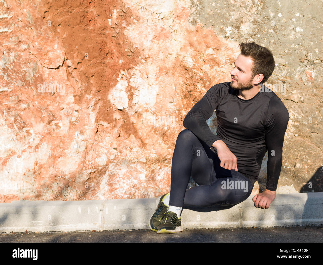 Tired athlete taking a rest Stock Photo - Alamy