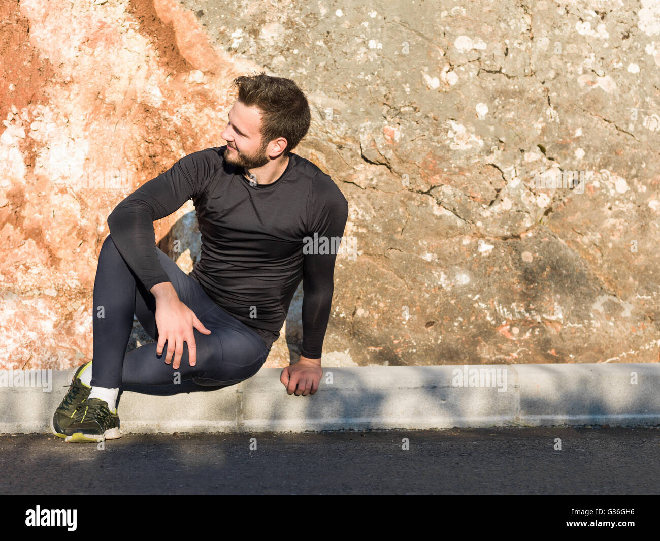 Athlete male runner running on mountain road. Running man jogging fast ...