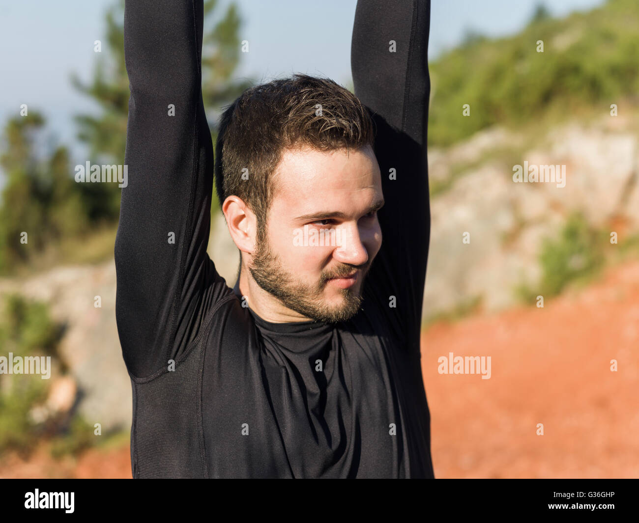 Athlete male runner running on mountain road. Running man jogging fast ...