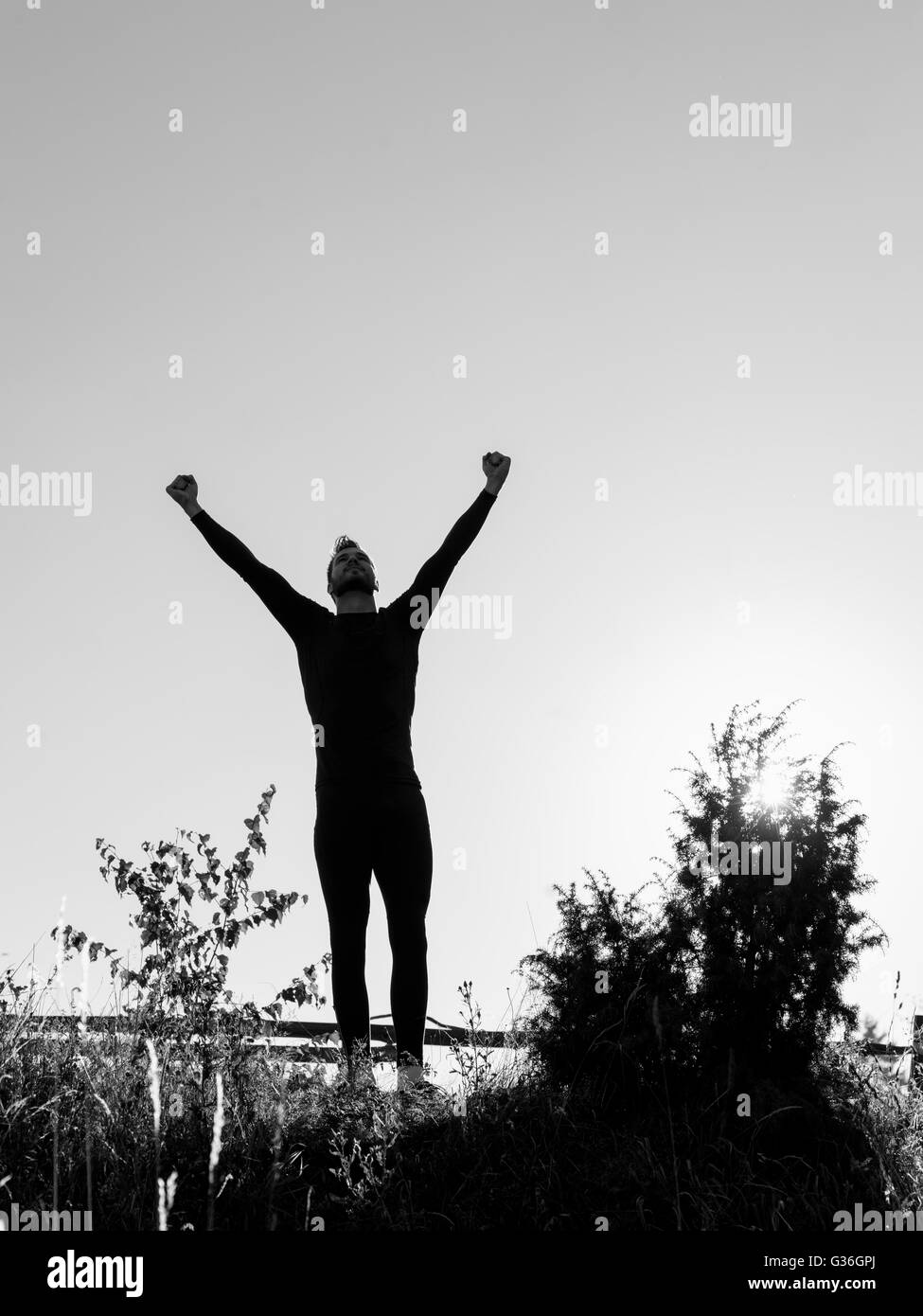 Raising arms to the sky Black and White Stock Photos & Images - Alamy