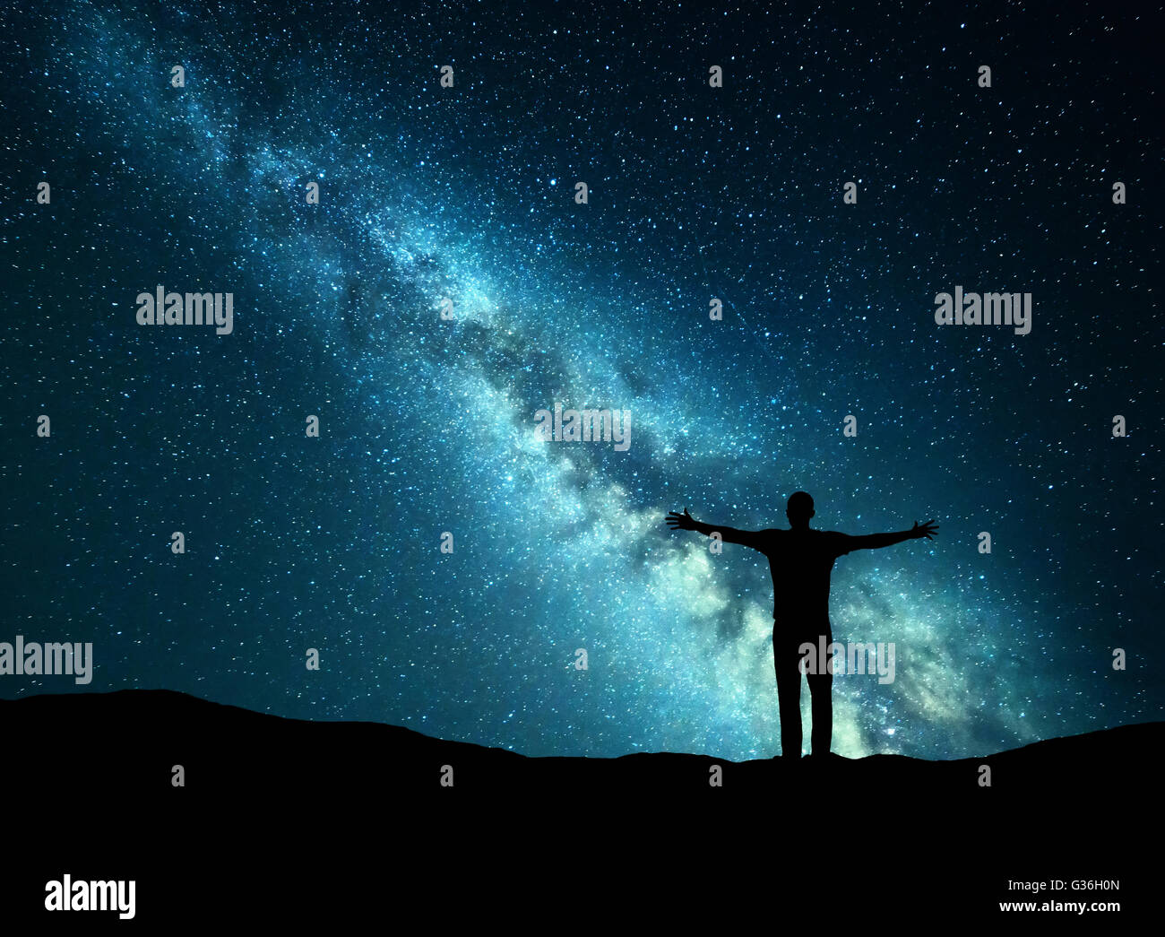 Night colorful landscape with green Milky Way and silhouette of a happy ...