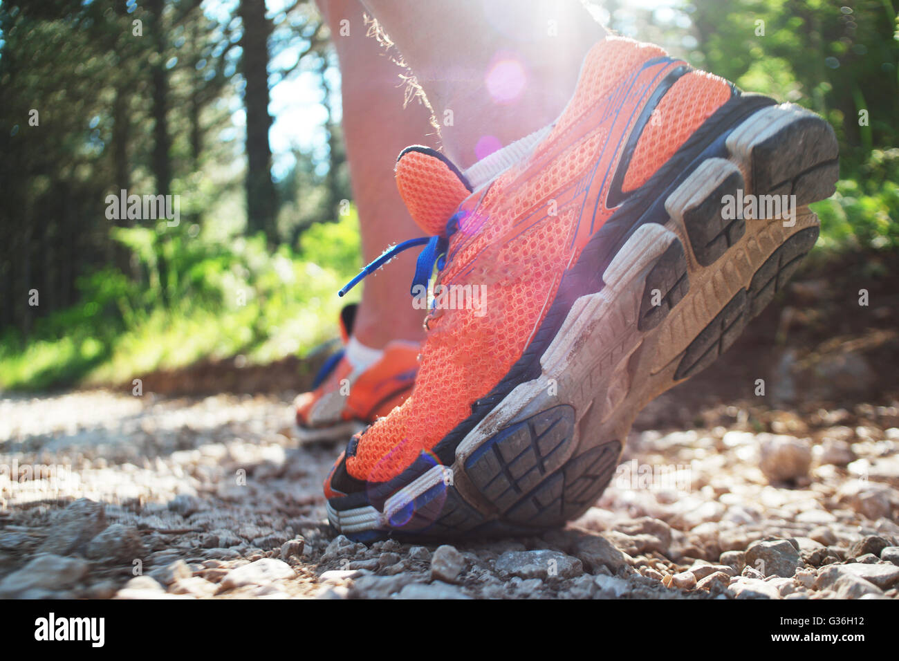 Close up of man walking on nature trail near forest preserve. Color ...