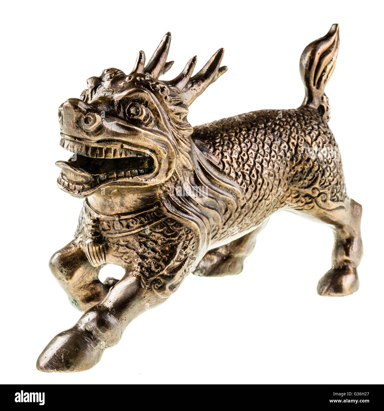a bronze chinese dog or dragon isolated over a white background Stock ...