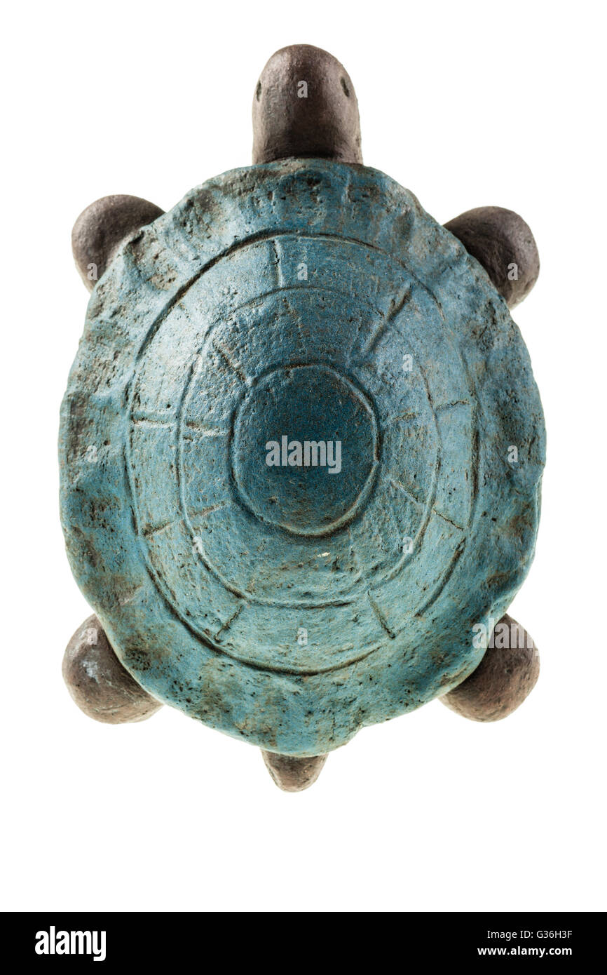 a small clay turtle figurine isolated over a white background Stock ...