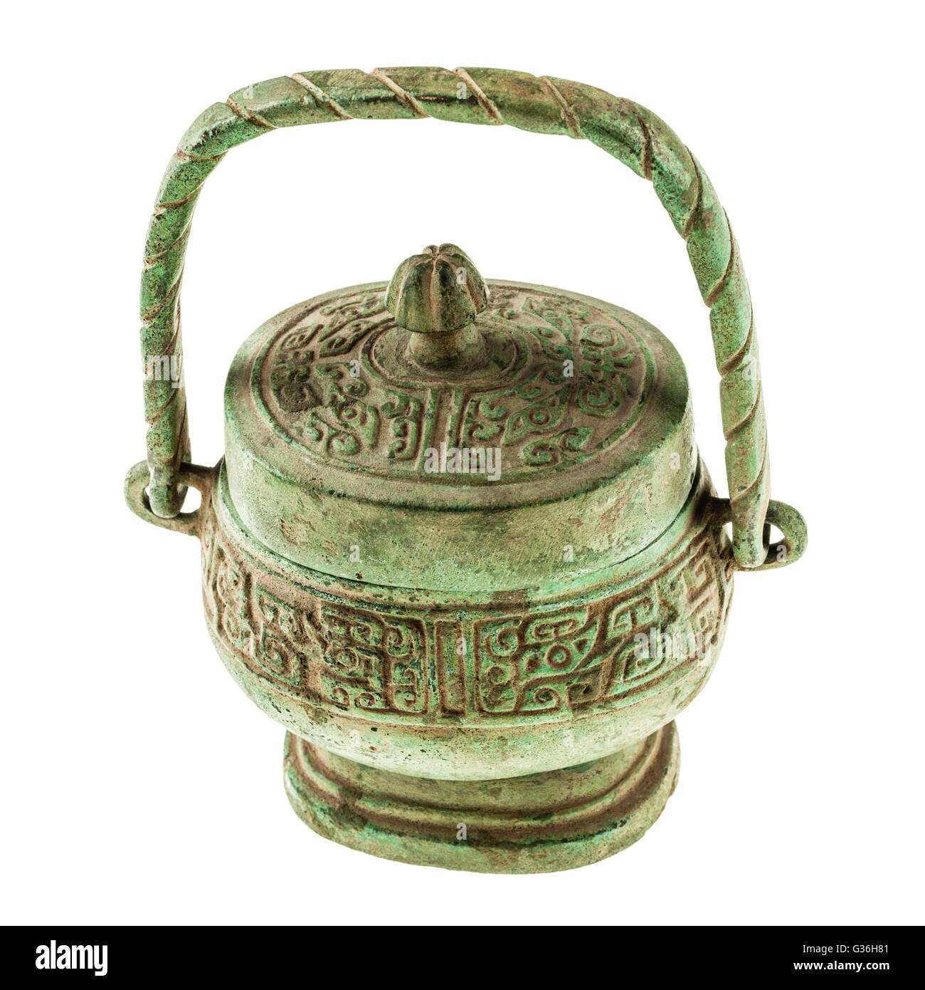a corroded ancient chinese container isolated over a white background ...