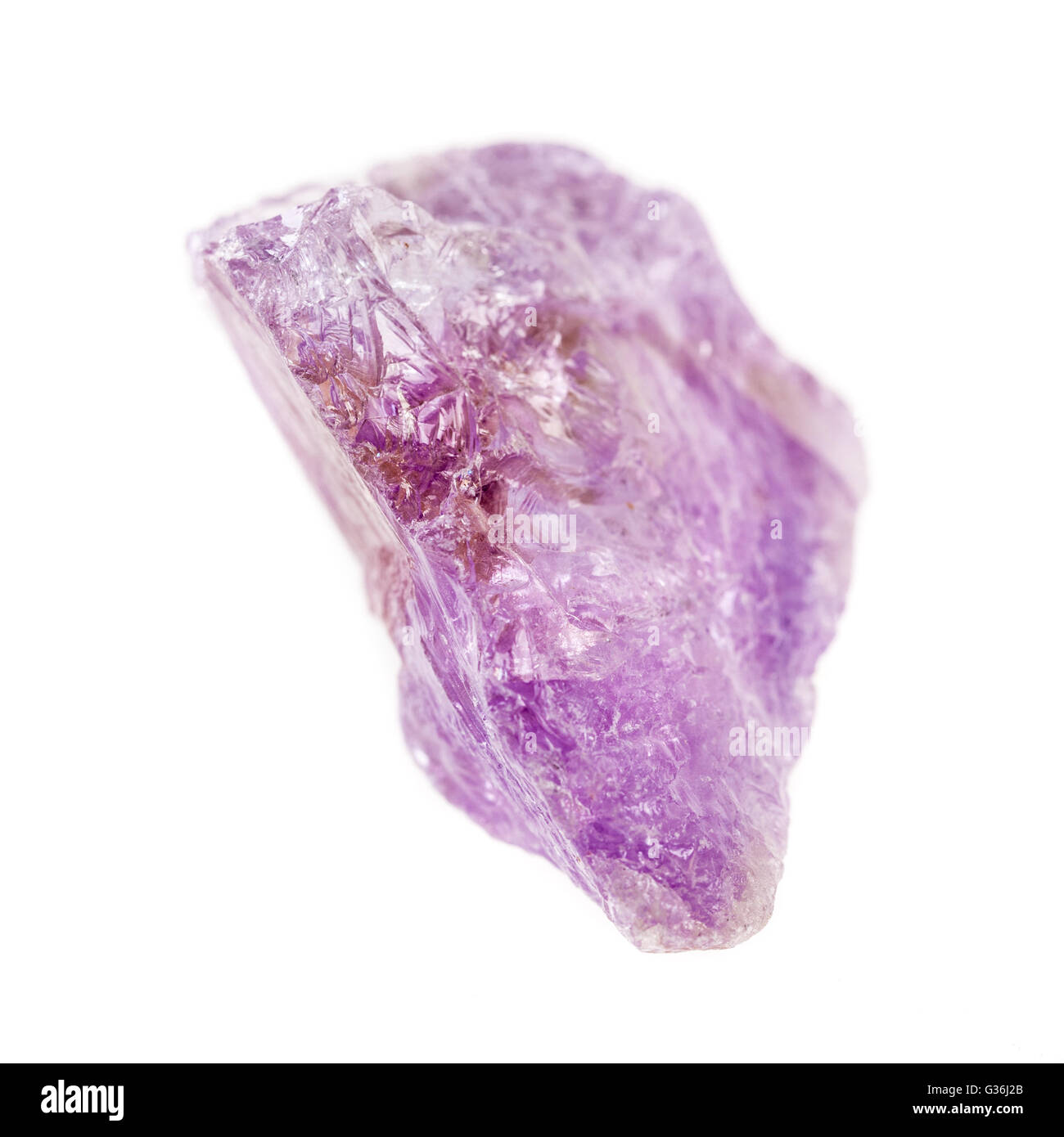 close up shot of a fragment of amethyst mineral isolated on a white ...