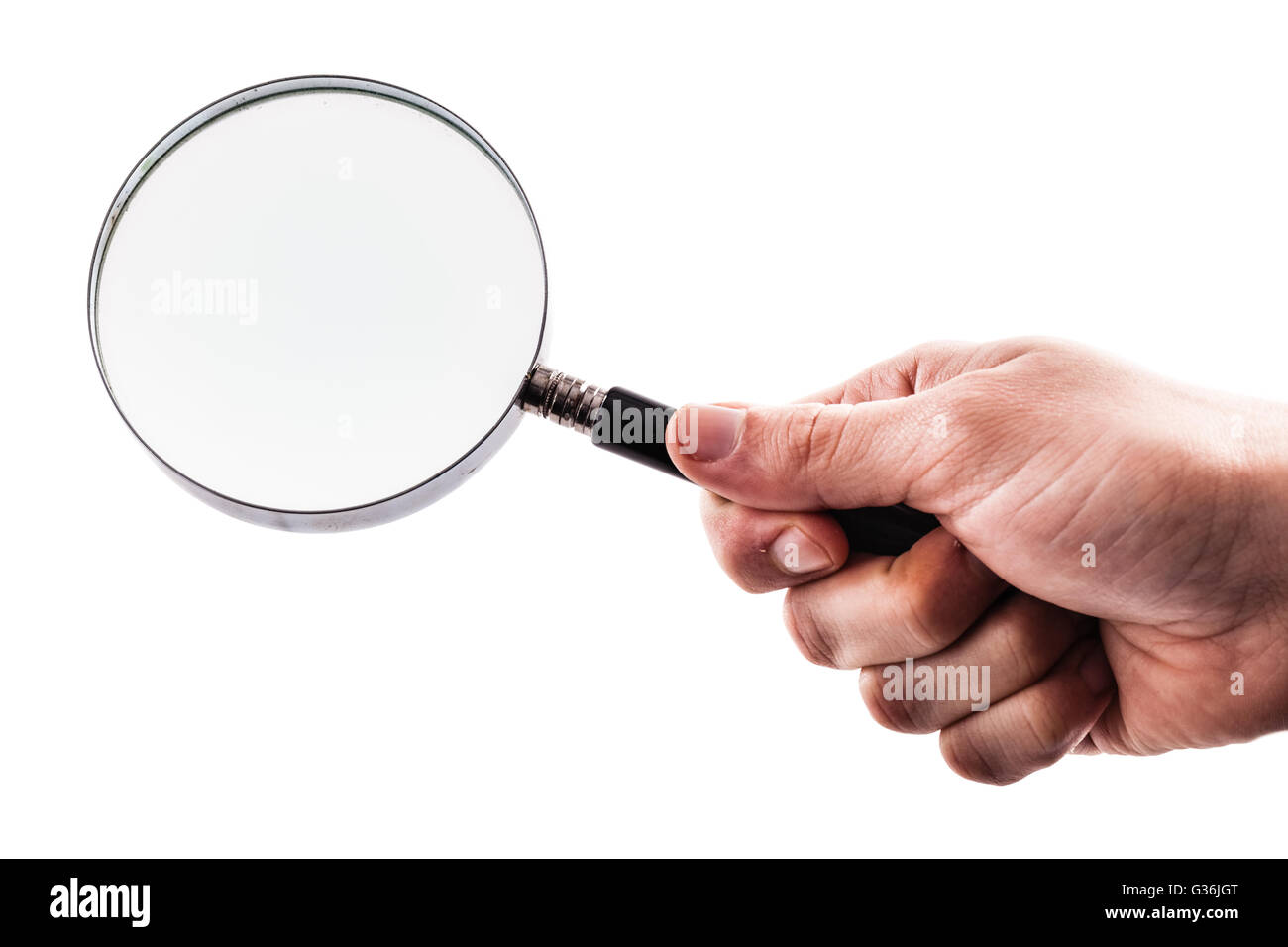 a male hand holding a magnifiyng glass isolated over a white background ...