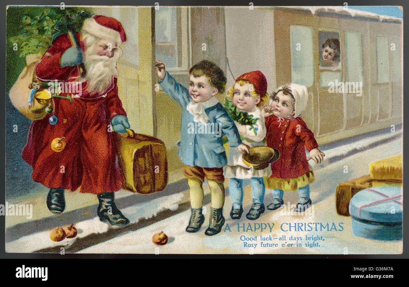Father Christmas arriving by train Stock Photo - Alamy