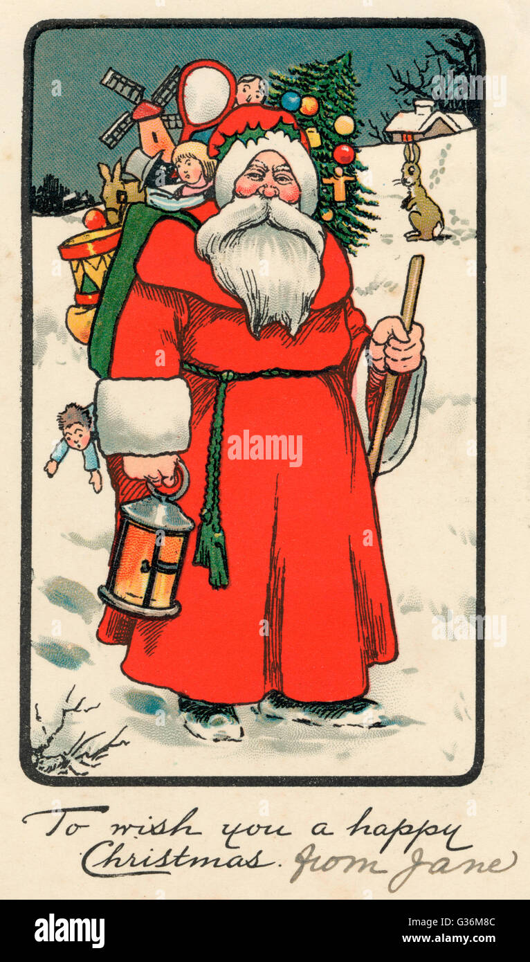 Father Christmas with a sack of toys Stock Photo - Alamy