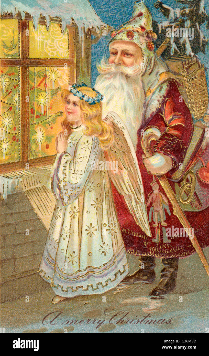Father Christmas and an angel Stock Photo - Alamy
