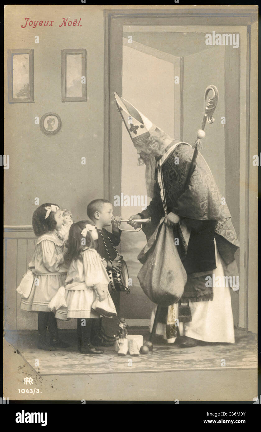 Saint Nicholas giving Christmas presents to children Stock Photo - Alamy